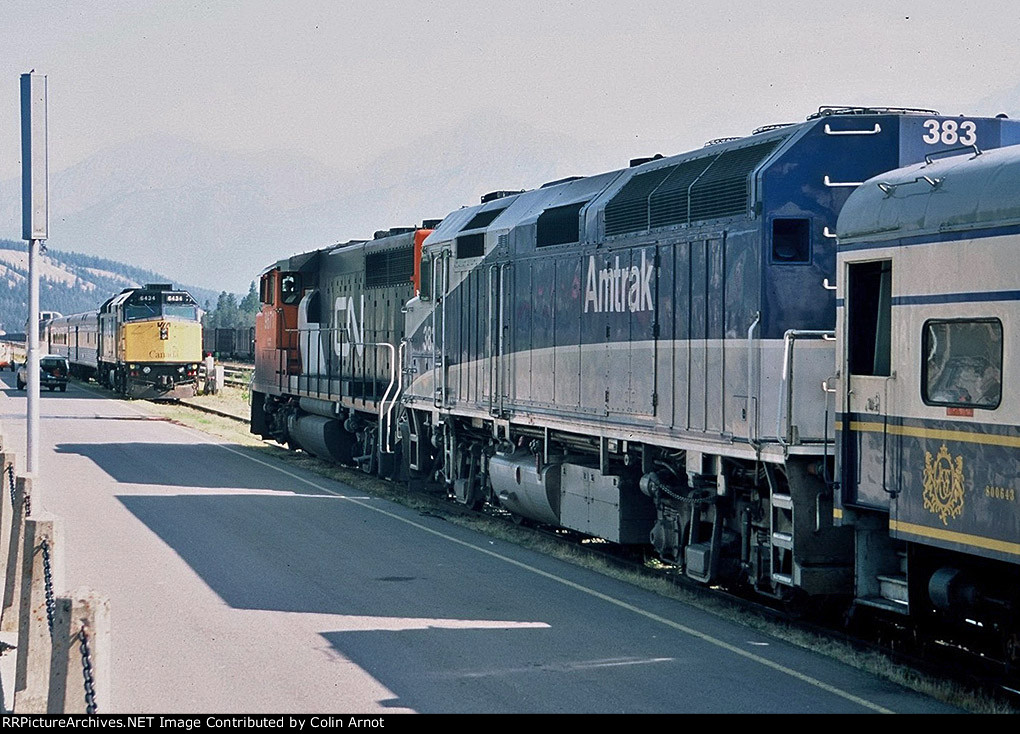 The American Orient Express sits in Jas}er Station behind CN 9671 and Amtrak 383, with the ...